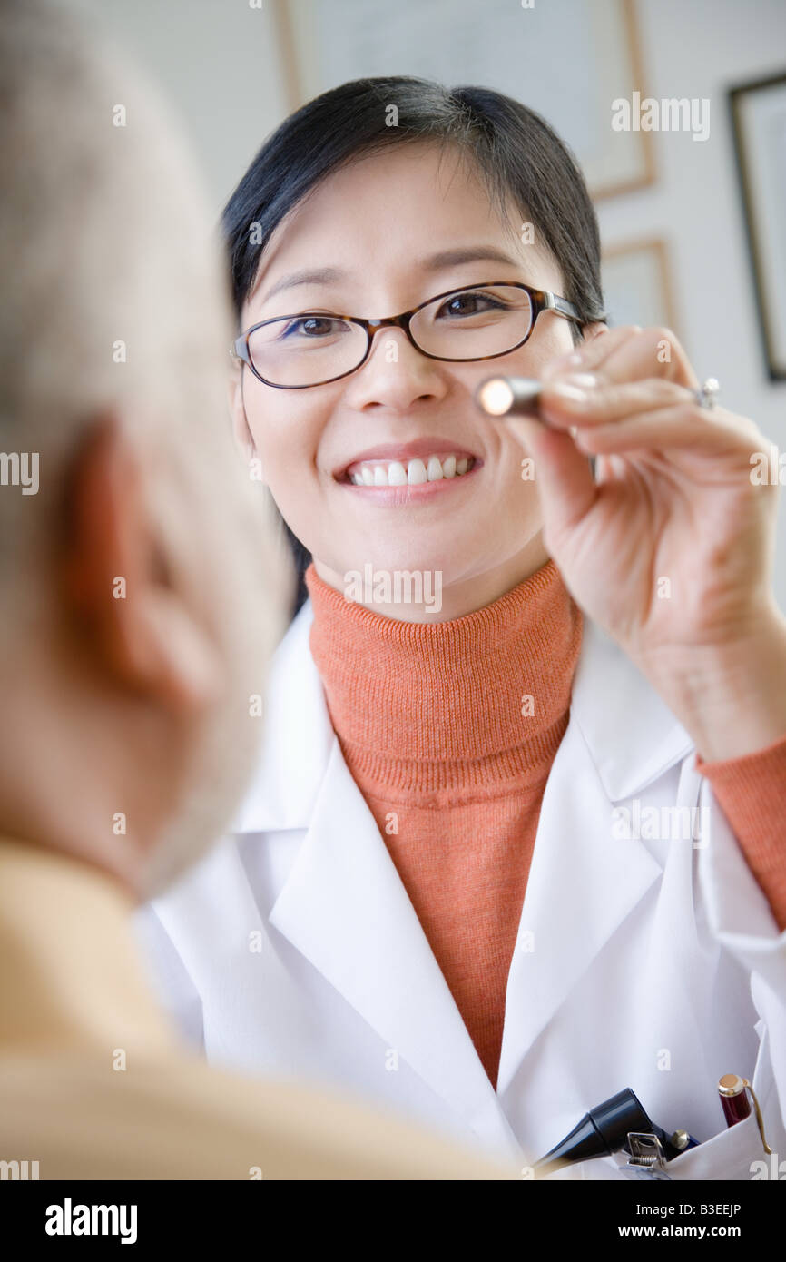 Unrecognizable doctors examining woman hi-res stock photography and ...
