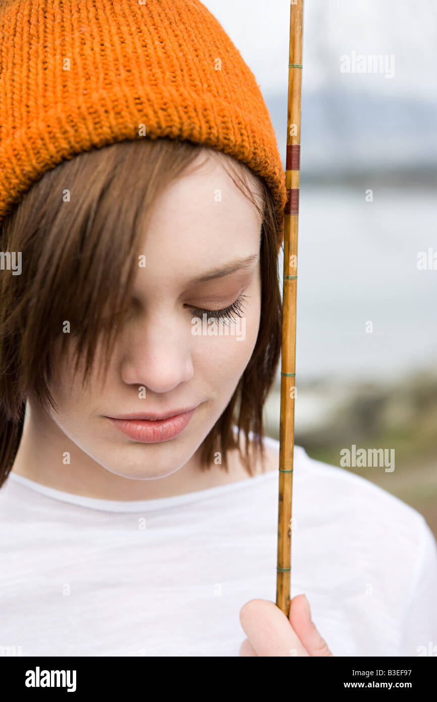 Woman with fishing rod Stock Photo - Alamy