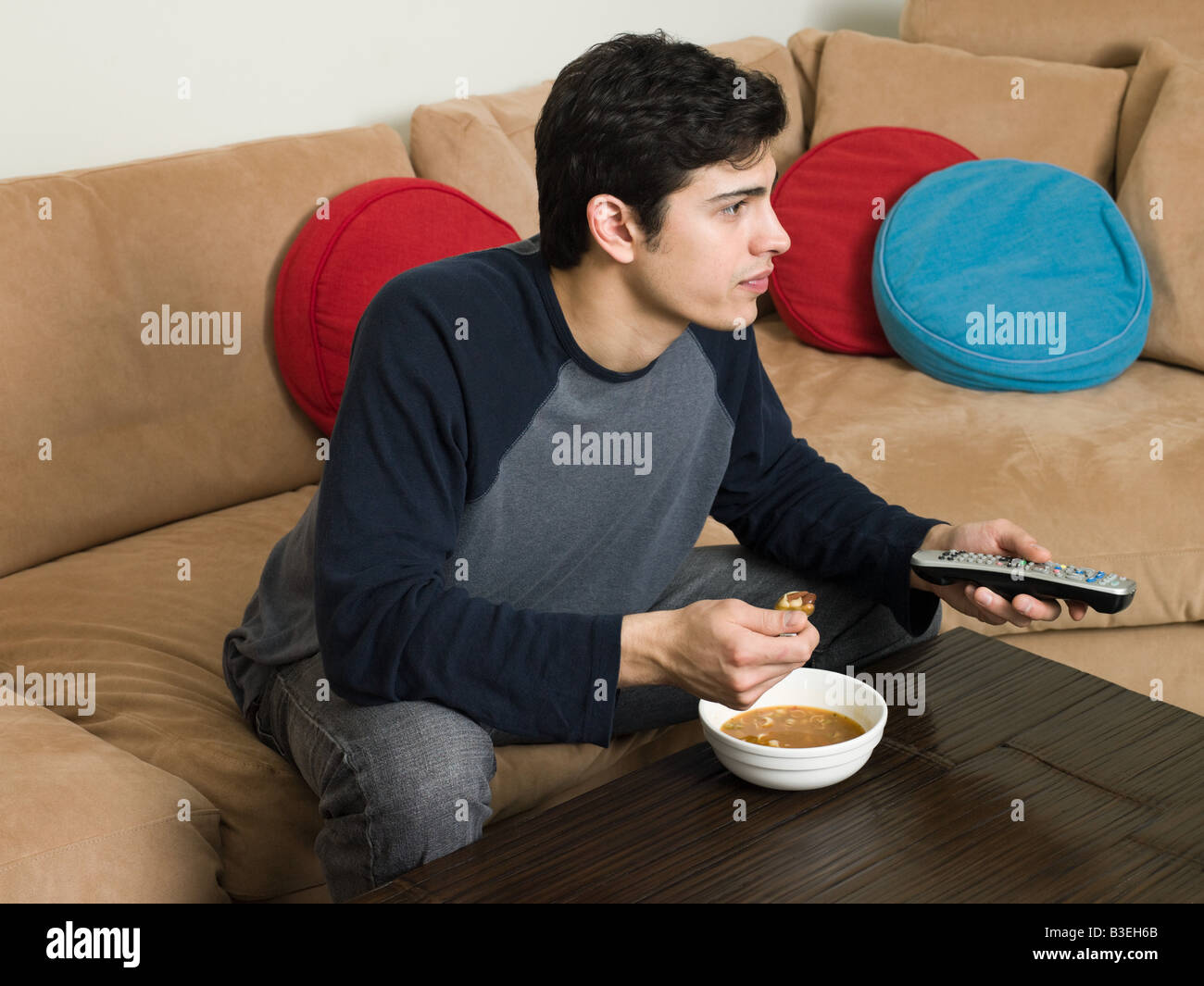 Eating soup watching tv hi-res stock photography and images - Alamy