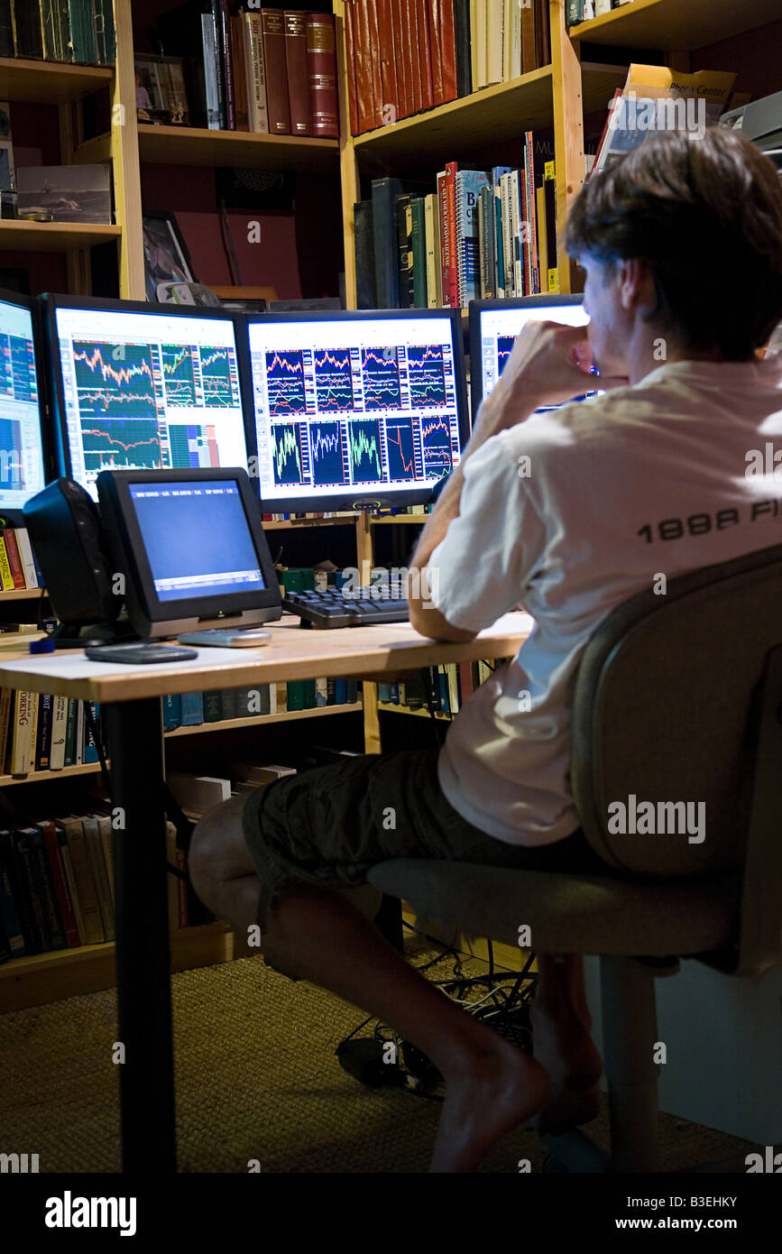 Man looking at graphs Stock Photo - Alamy