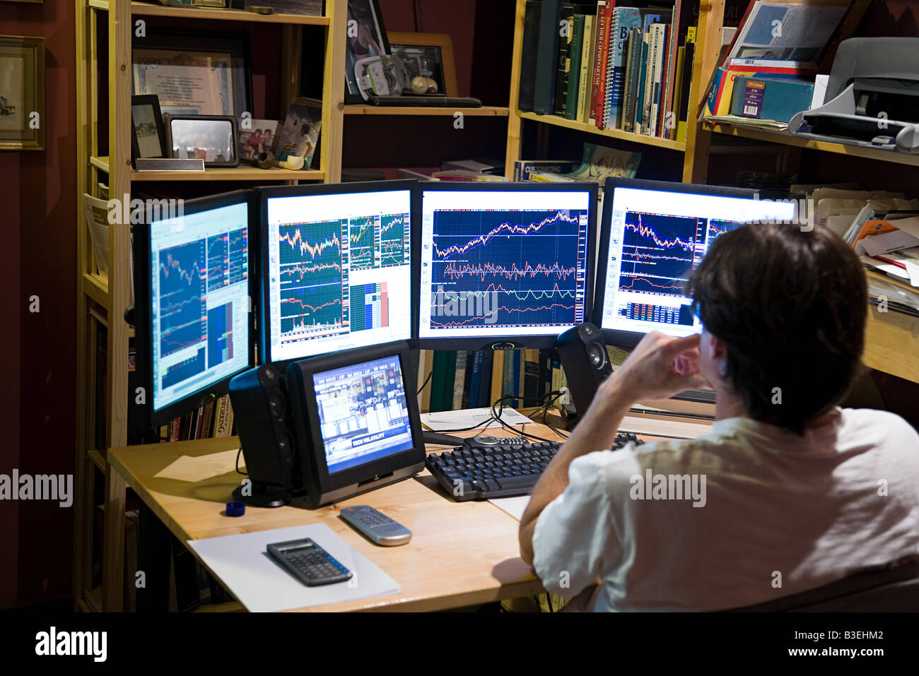 Man looking at graphs Stock Photo - Alamy