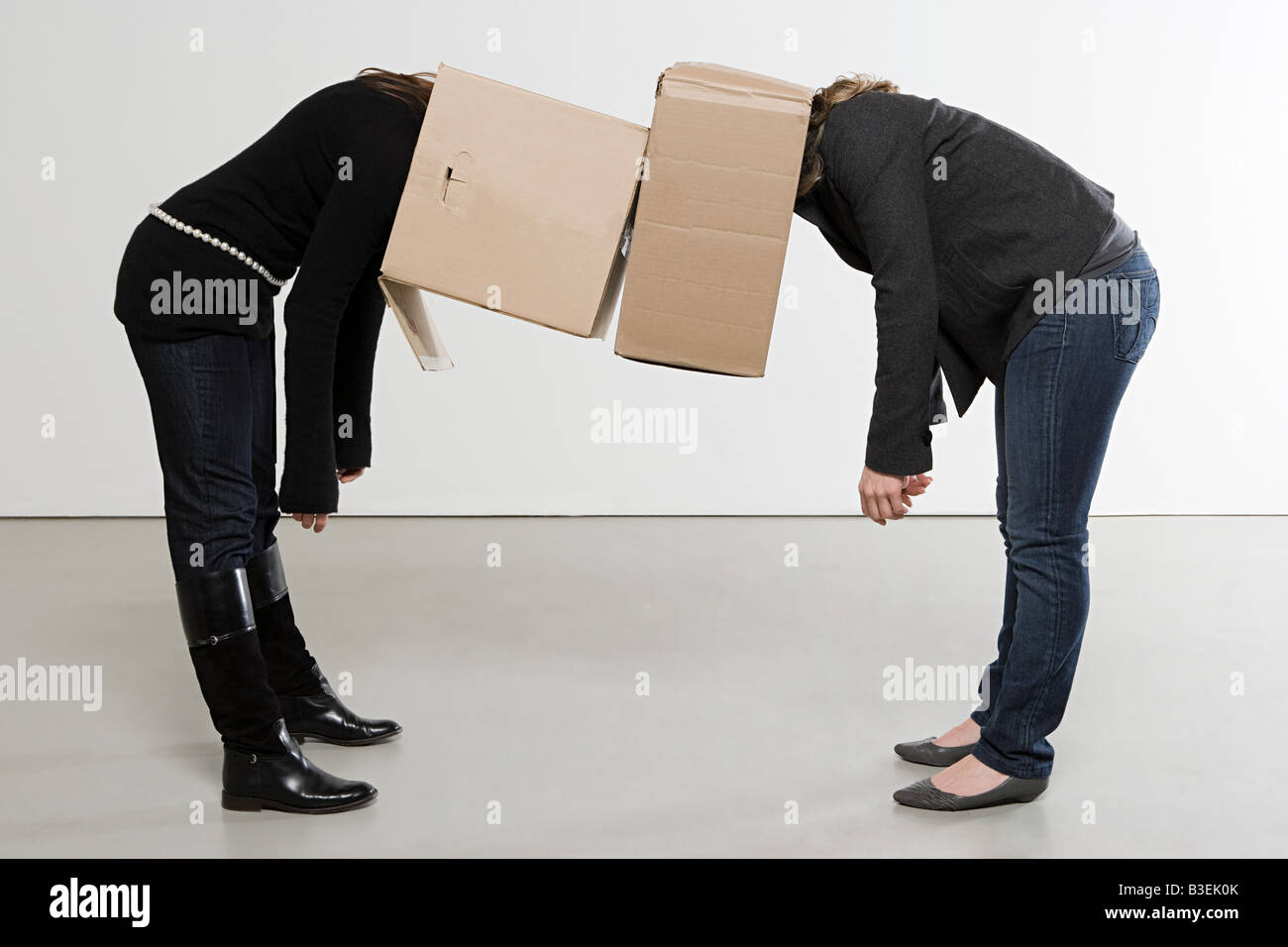 Women with boxes on their heads Stock Photo - Alamy