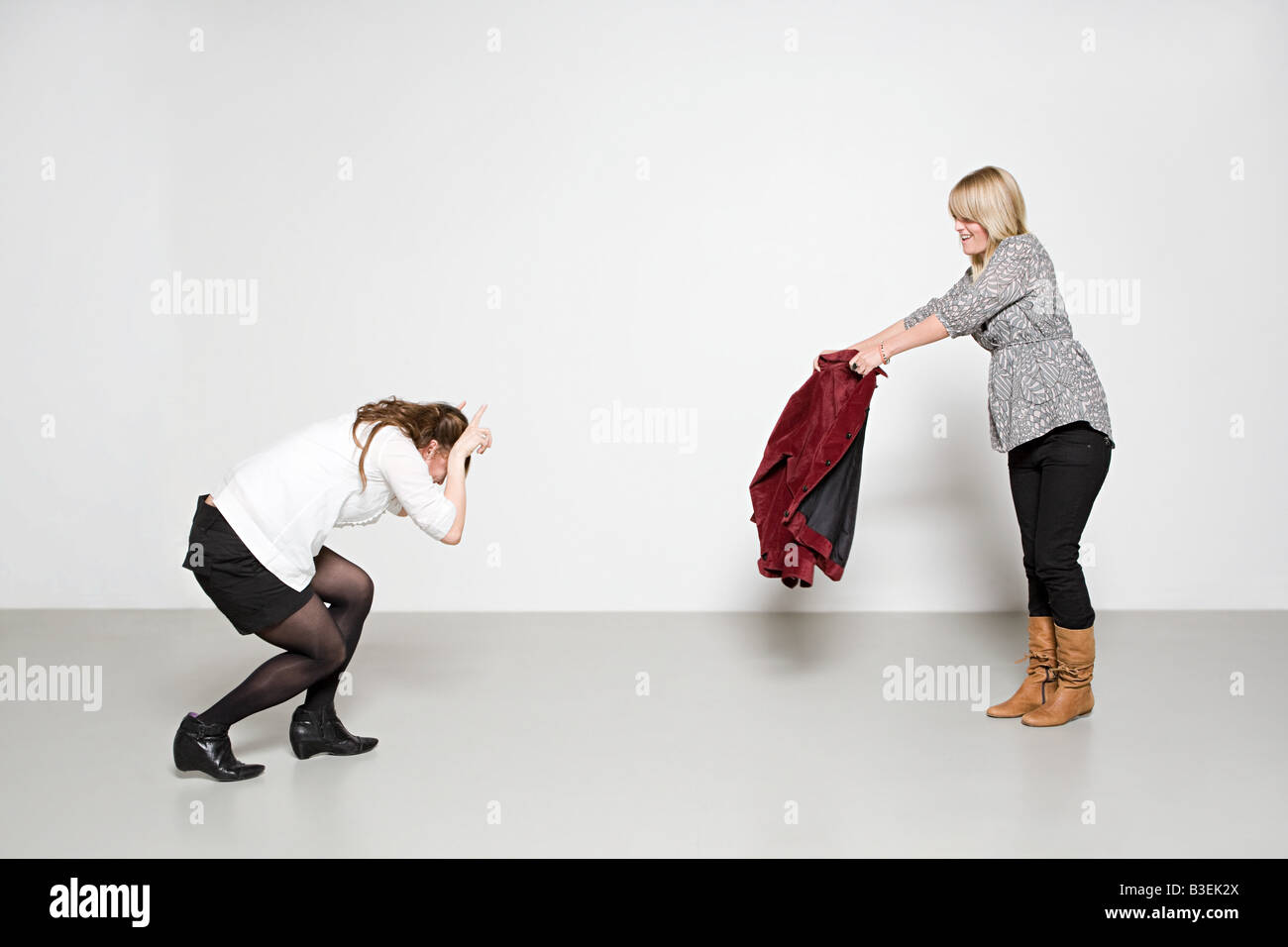 Women pretending to be bull and bullfighter Stock Photo - Alamy