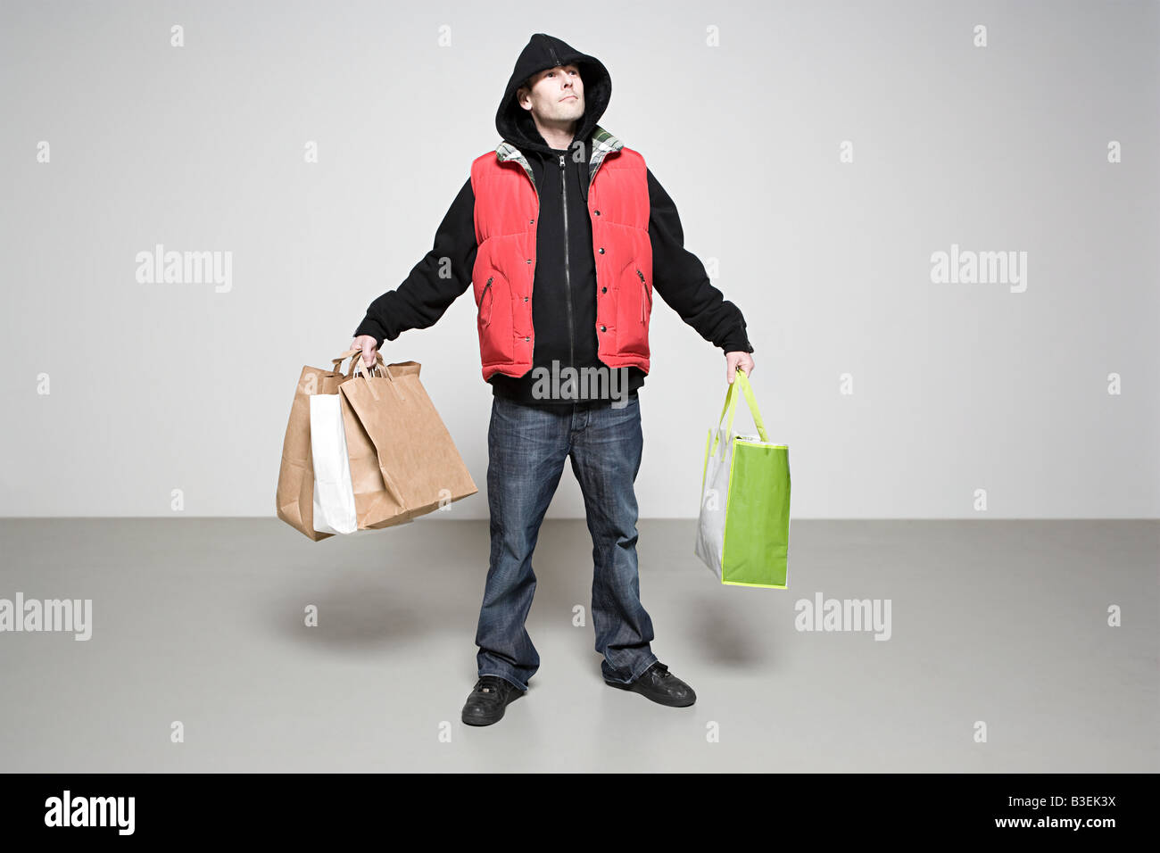 Man with bags Stock Photo - Alamy