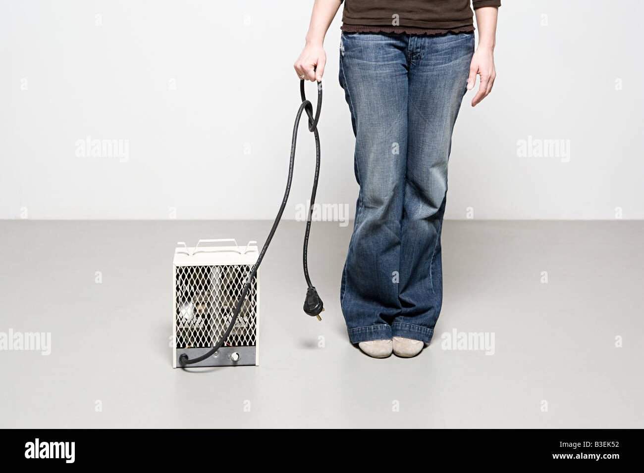 Woman holding cable Stock Photo - Alamy