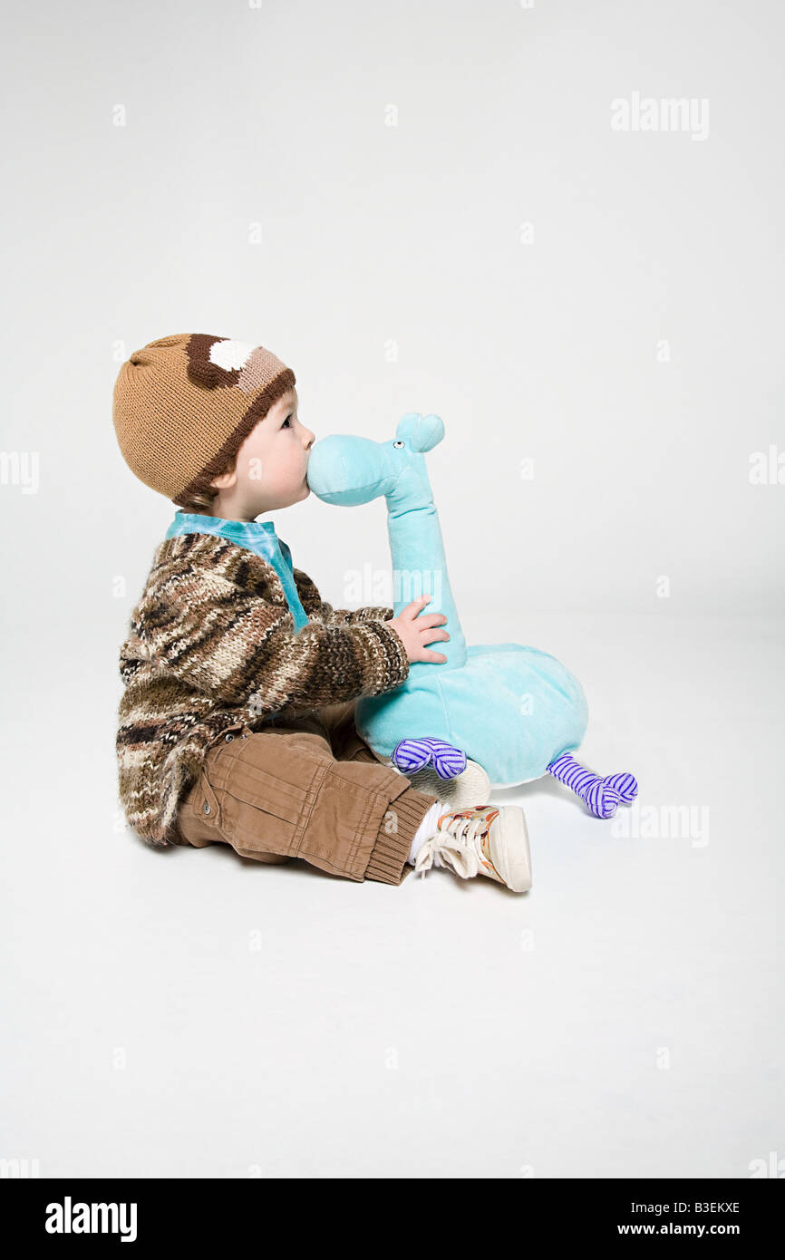 A boy and a soft toy Stock Photo - Alamy
