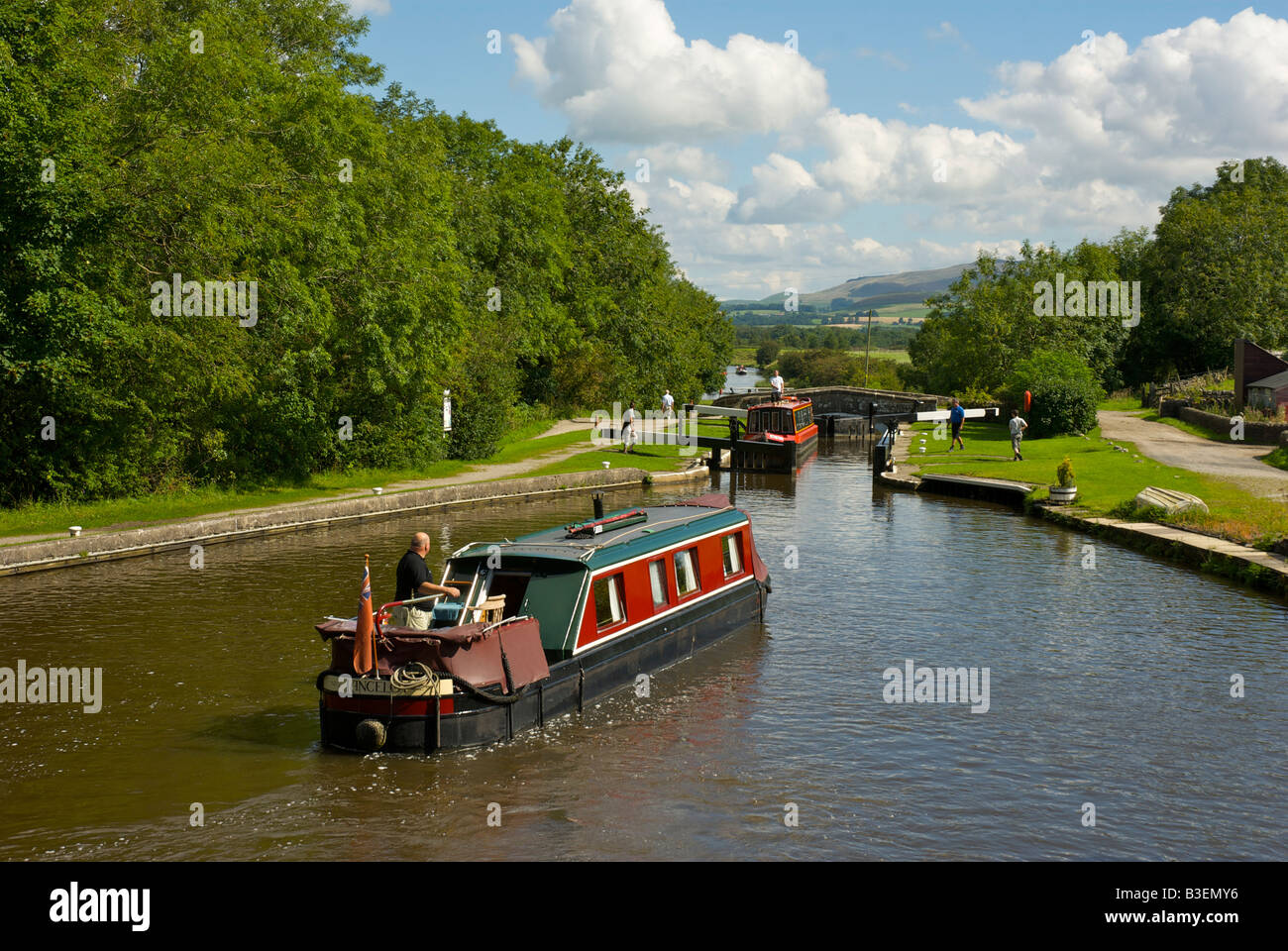 Narrowboats negotiating locks on Leeds-Liverpool Canal near Gargrave ...