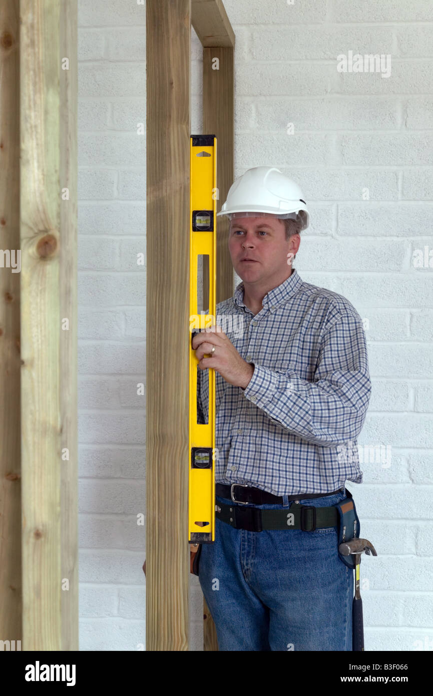 Carpenter checking a timber frame is square and level Stock Photo - Alamy