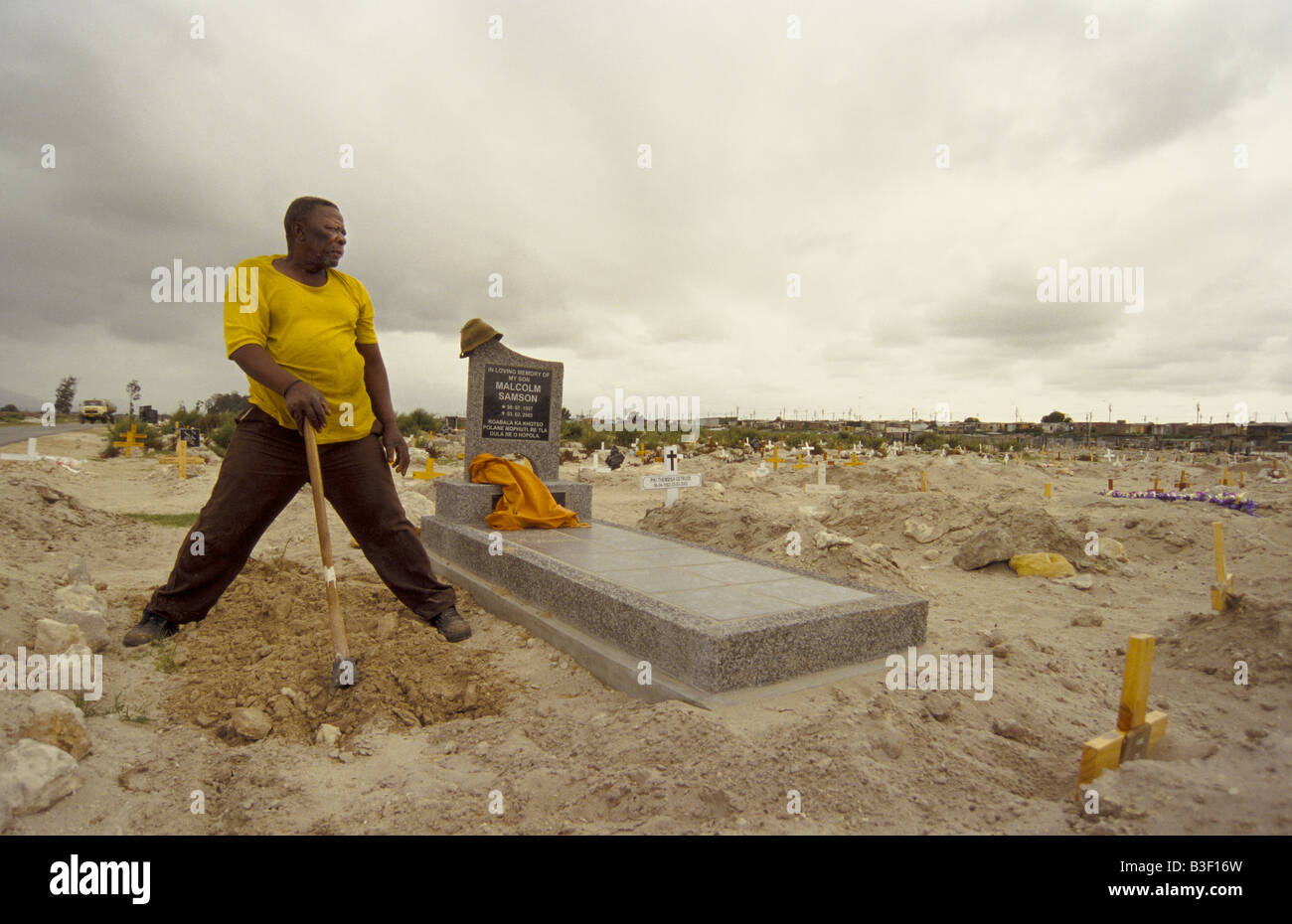 Grave digger at work in Guguletu township cemetery Cape Town South ...