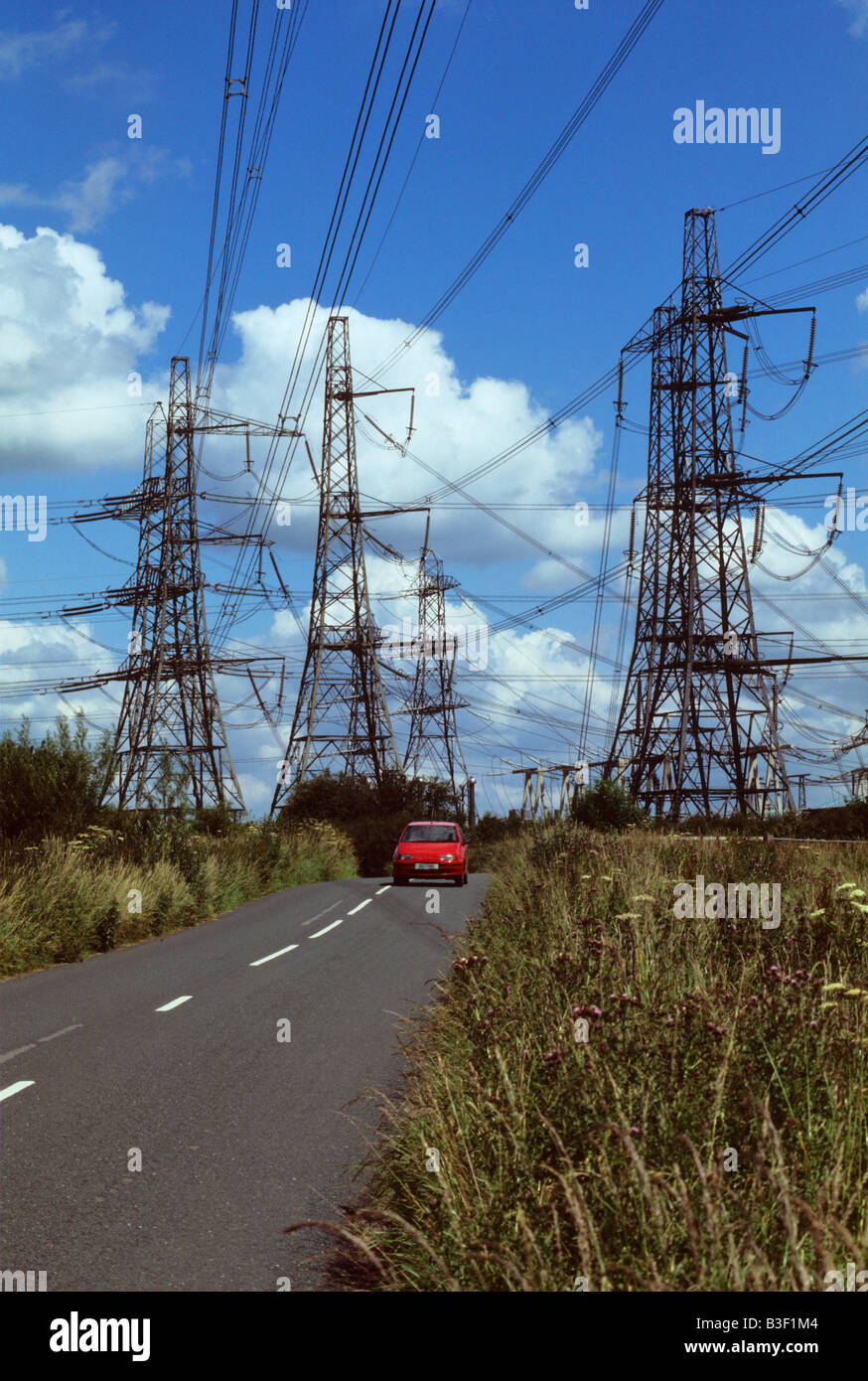 car passing giant electricity power pylons at Monk Fryston electricity ...