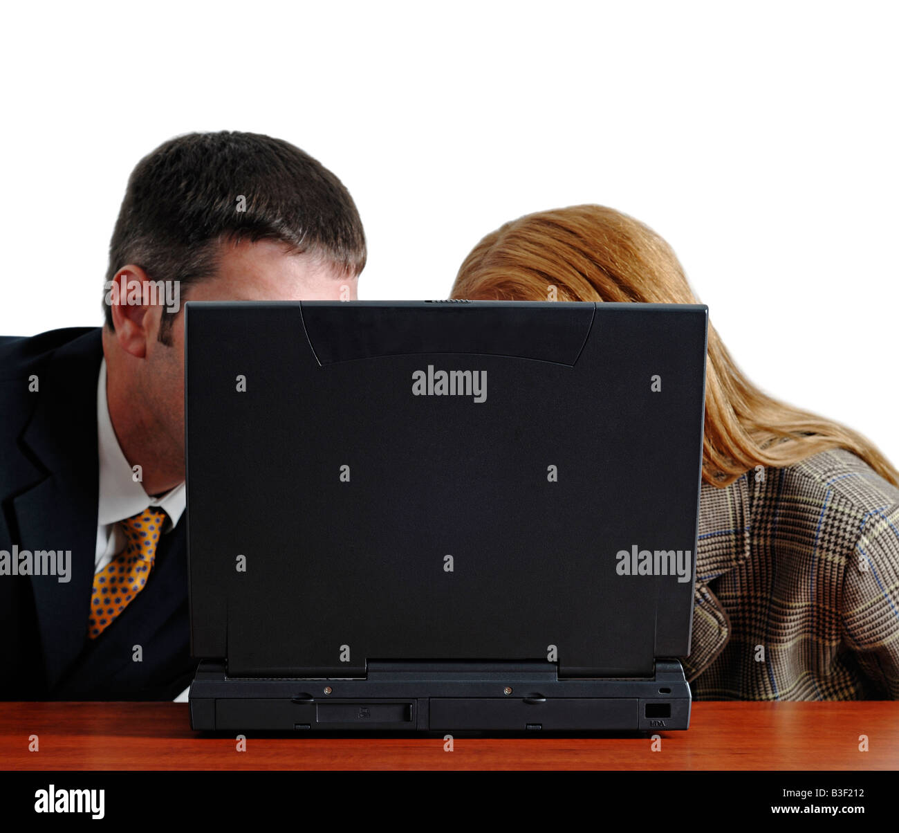 Businessman and Woman Looking at the Monitor of a Laptop in an Office ...