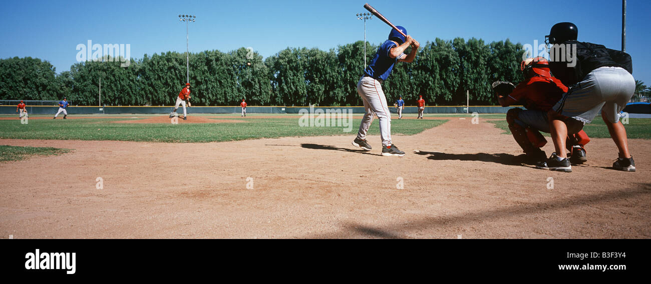Baseball players on playing field Stock Photo - Alamy