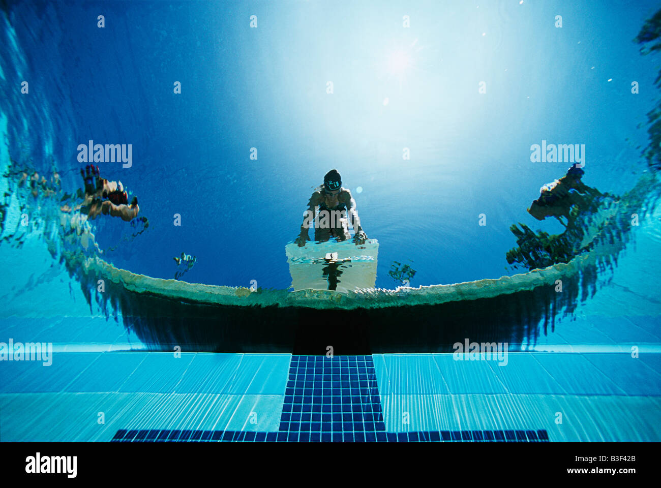 Underwater view of swimmers on diving boards Stock Photo - Alamy