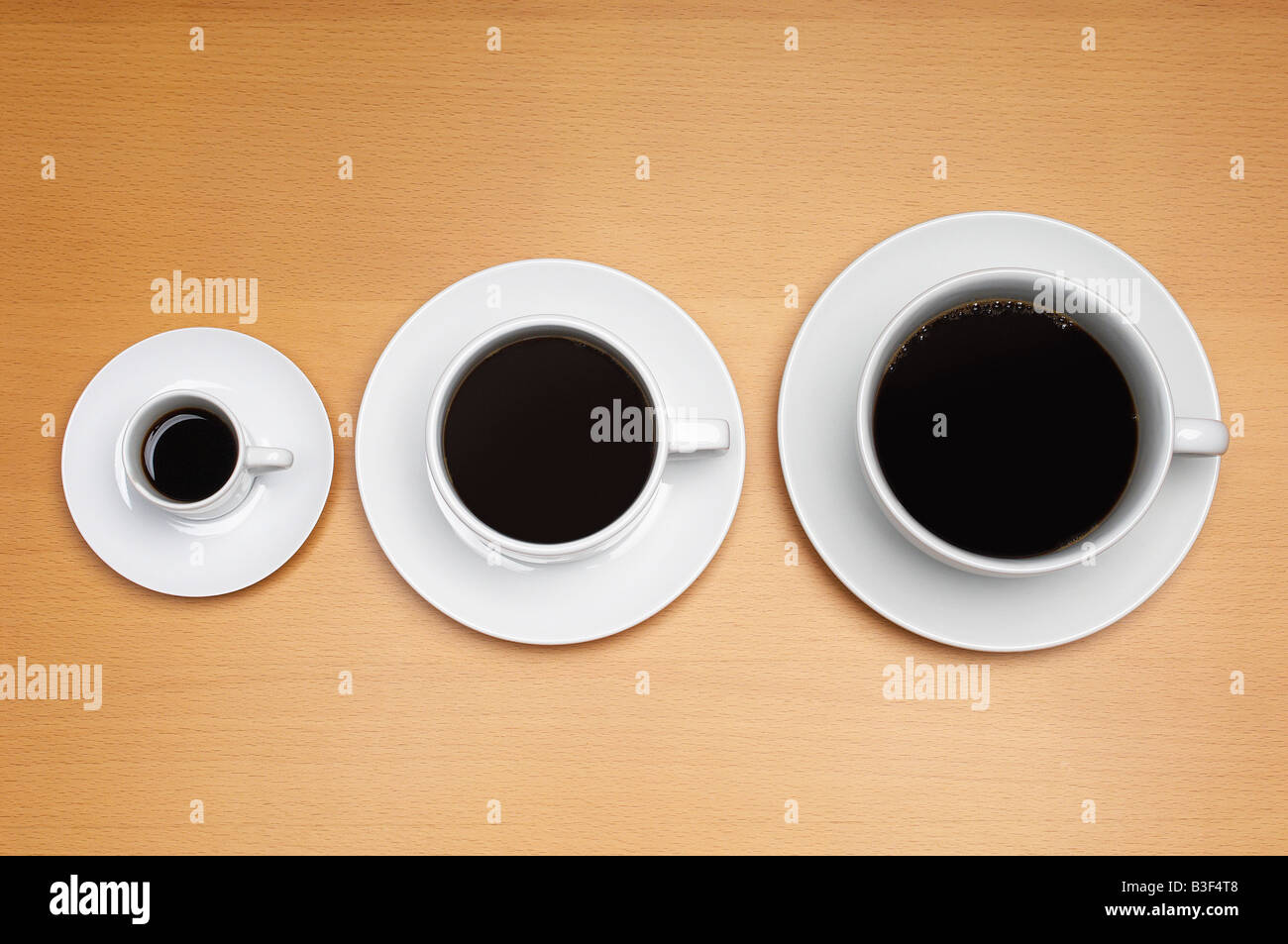 Three coffee cups of various sizes Stock Photo - Alamy