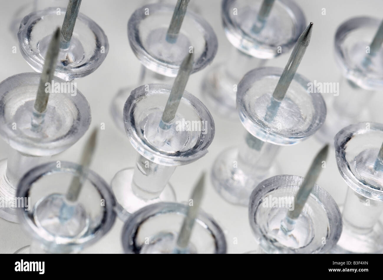 Transparent thumbtacks, close-up Stock Photo - Alamy