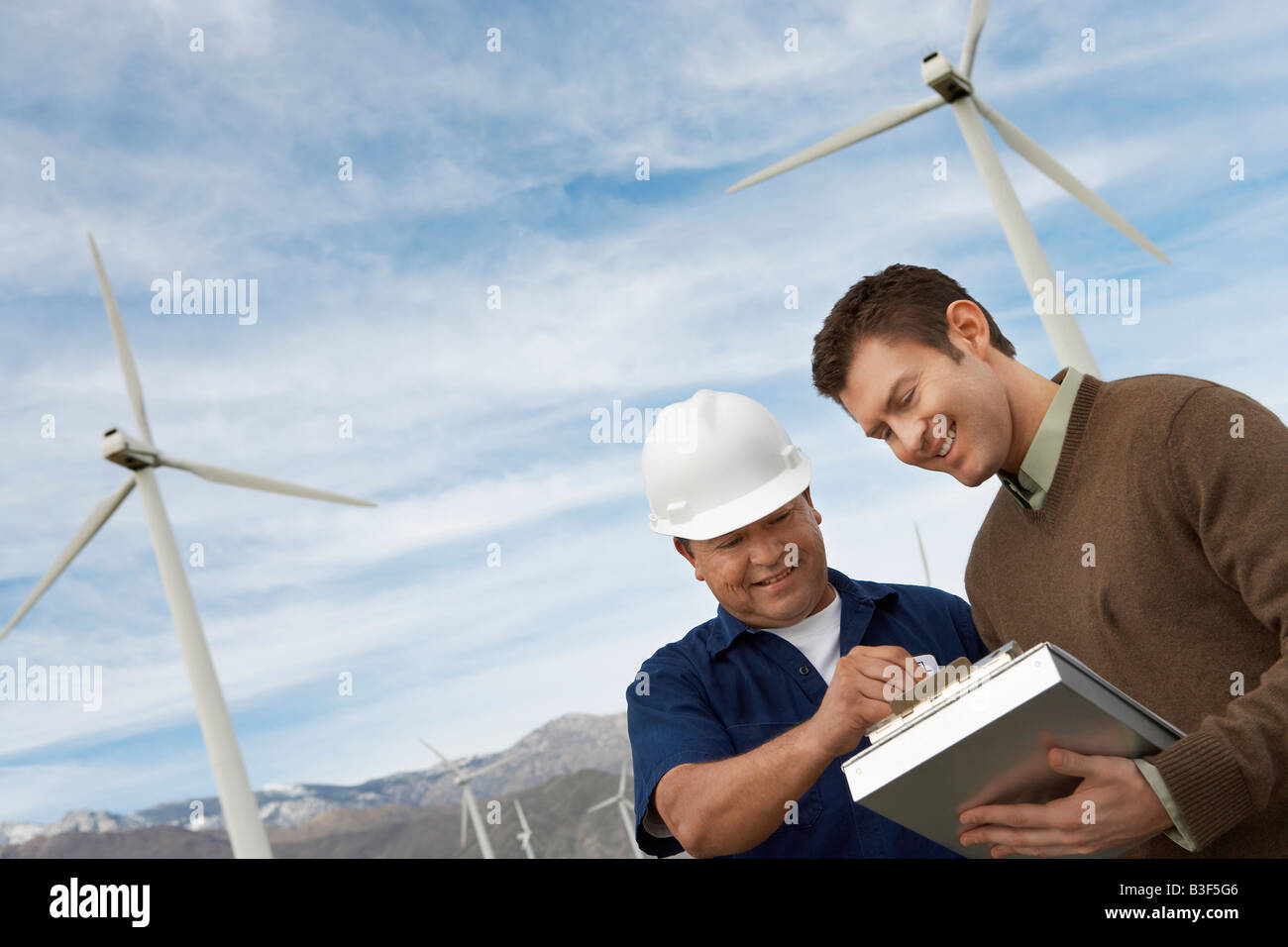 Engineers working at wind farm Stock Photo - Alamy