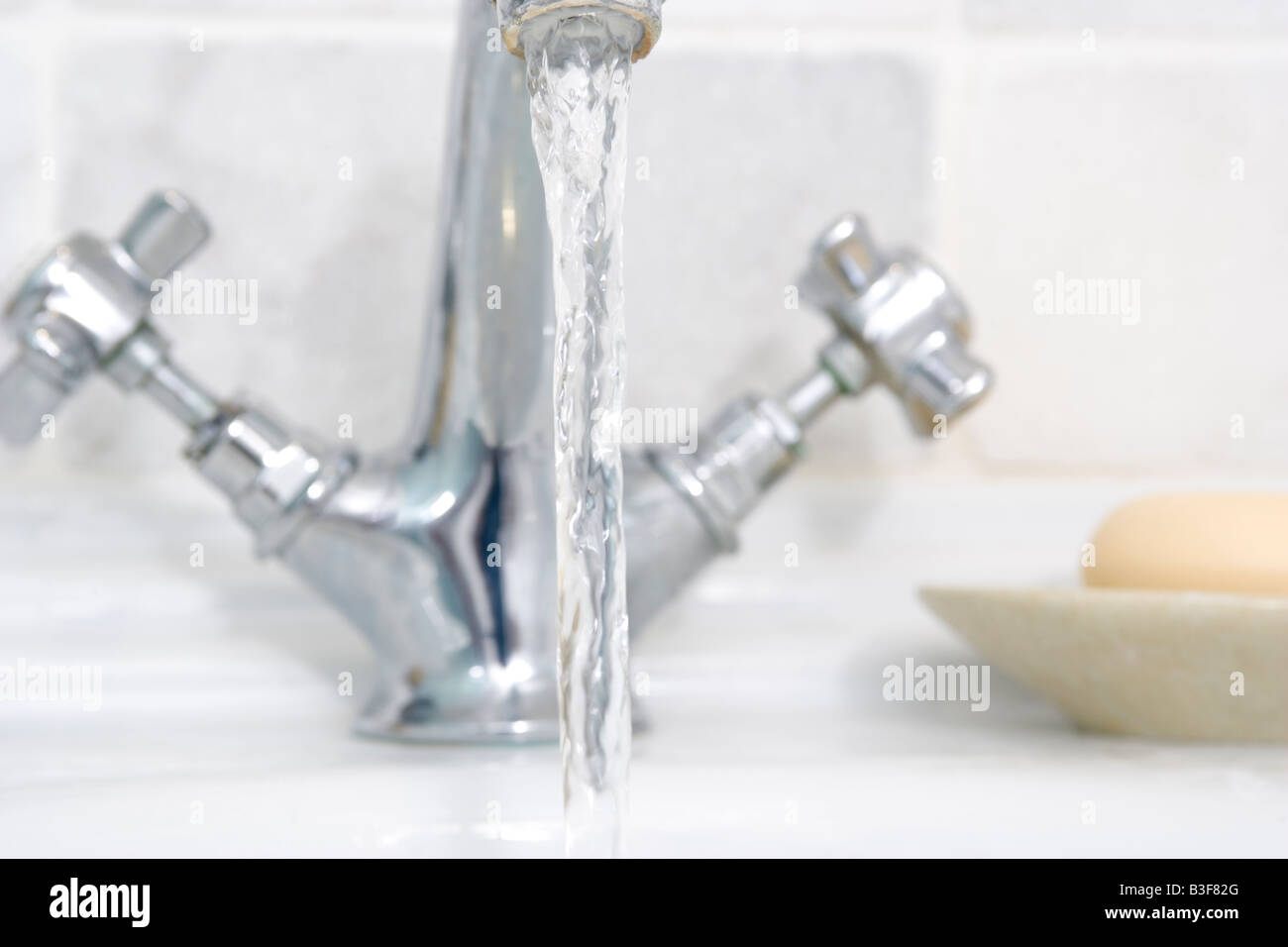 Running bathroom sink Stock Photo - Alamy