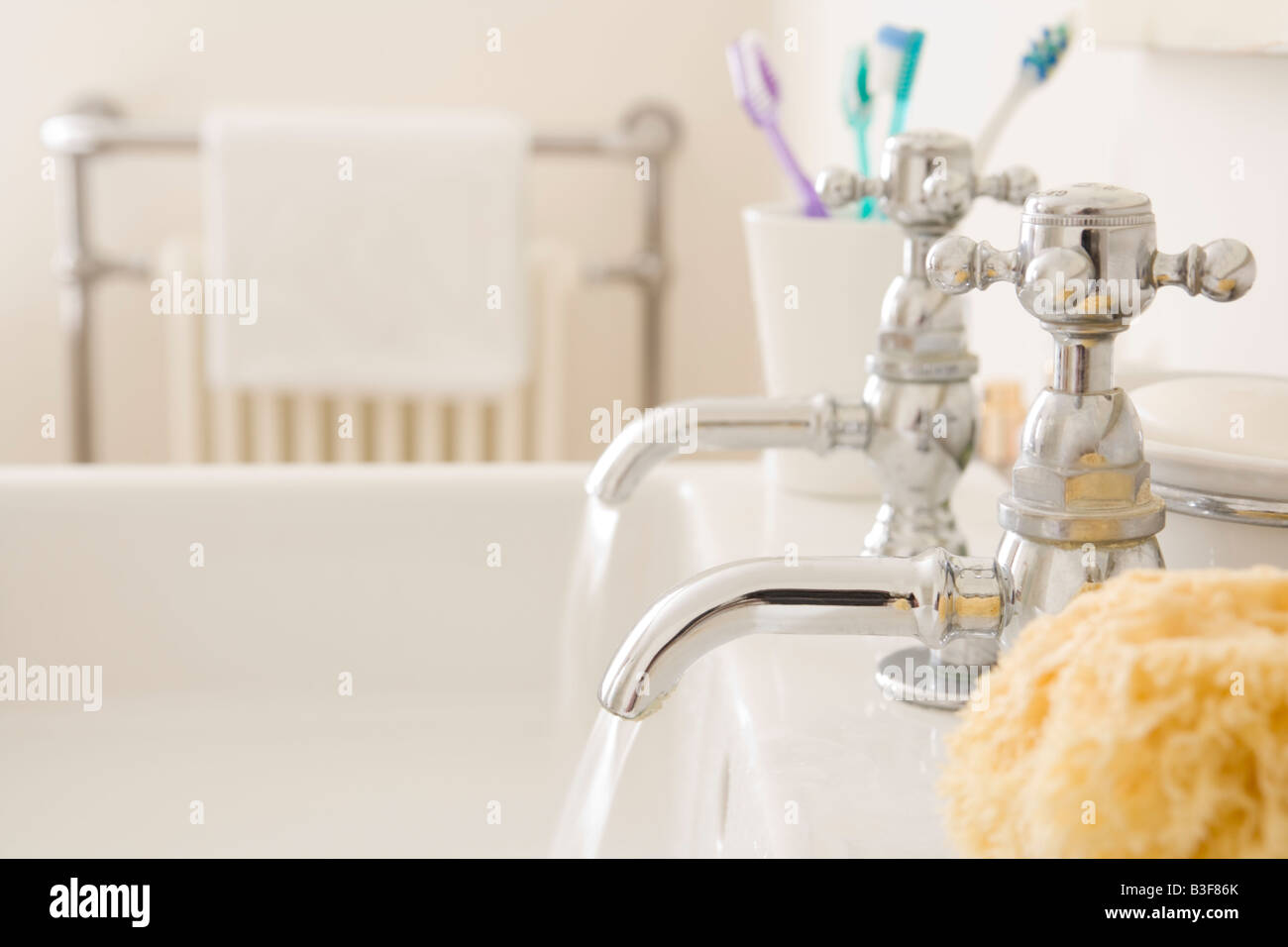 Running bathroom sink Stock Photo - Alamy