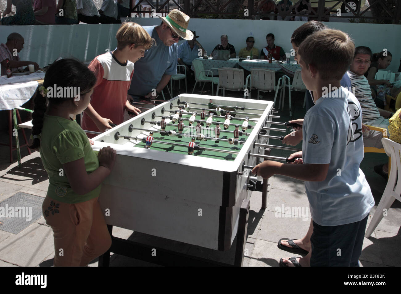 Playing table football soccer on the terrace of a bar in Chirche ...