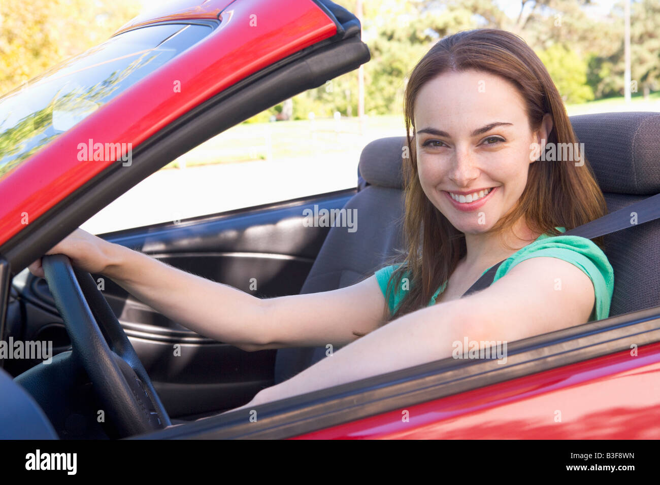 Woman in convertible car smiling Stock Photo - Alamy