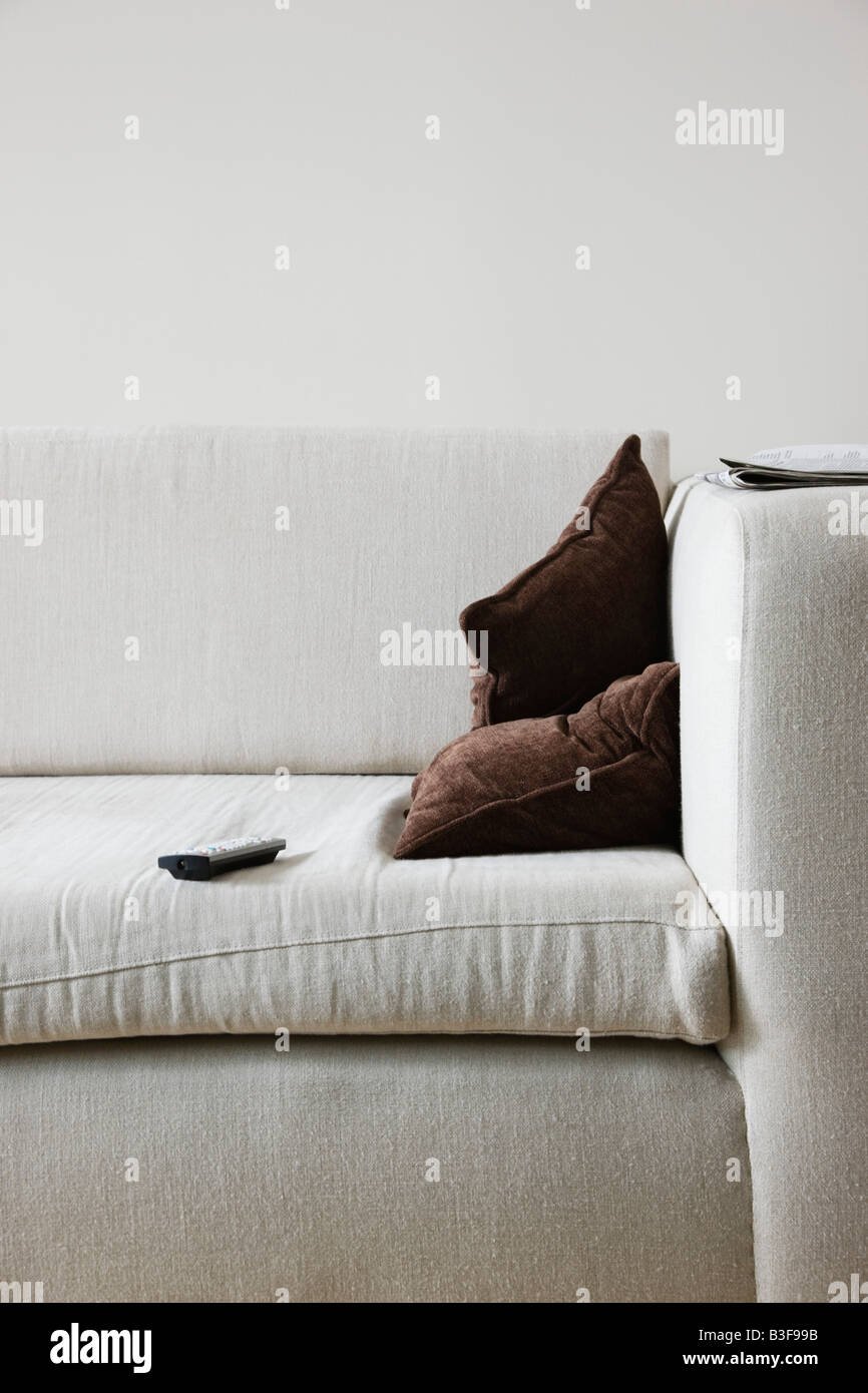 Remote control on sofa Stock Photo - Alamy