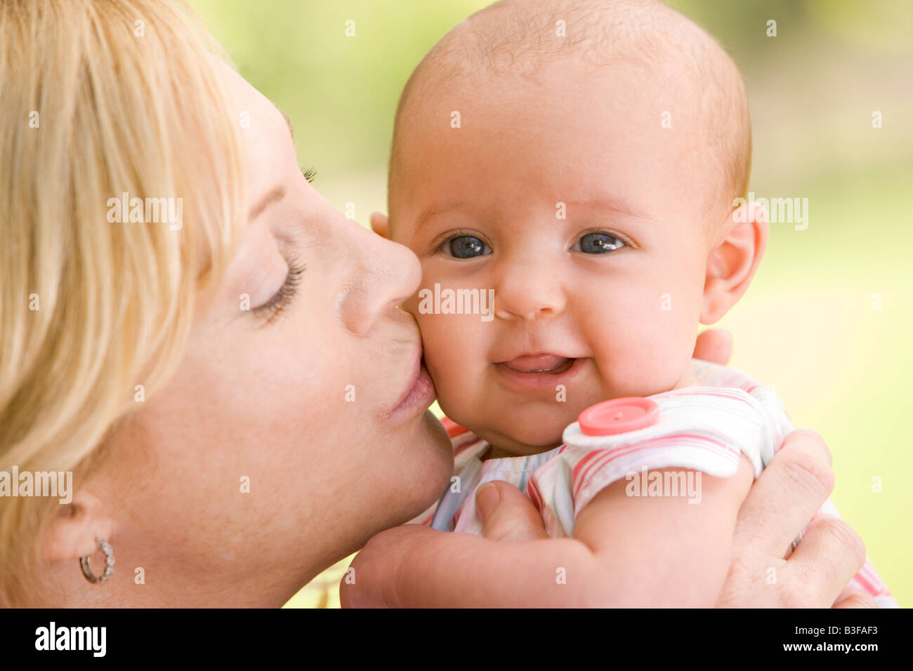 Mum kissing baby hi-res stock photography and images - Alamy