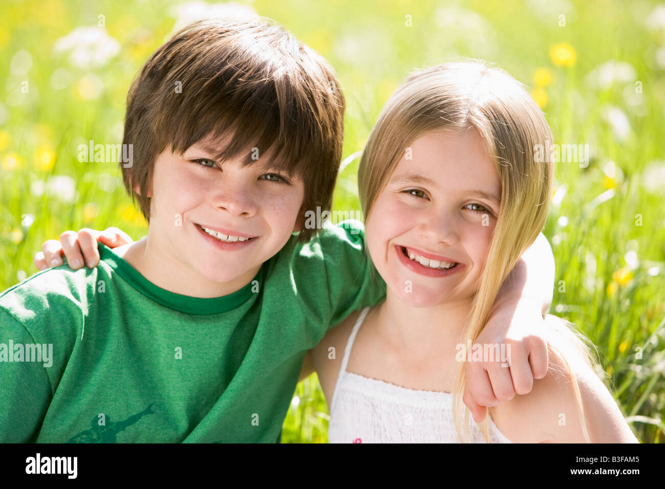 Girl in boy arms hugging sitting hi-res stock photography and images ...