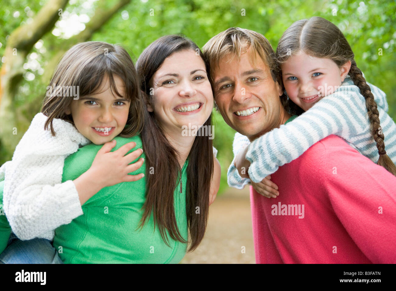 Family outdoors smiling Stock Photo - Alamy
