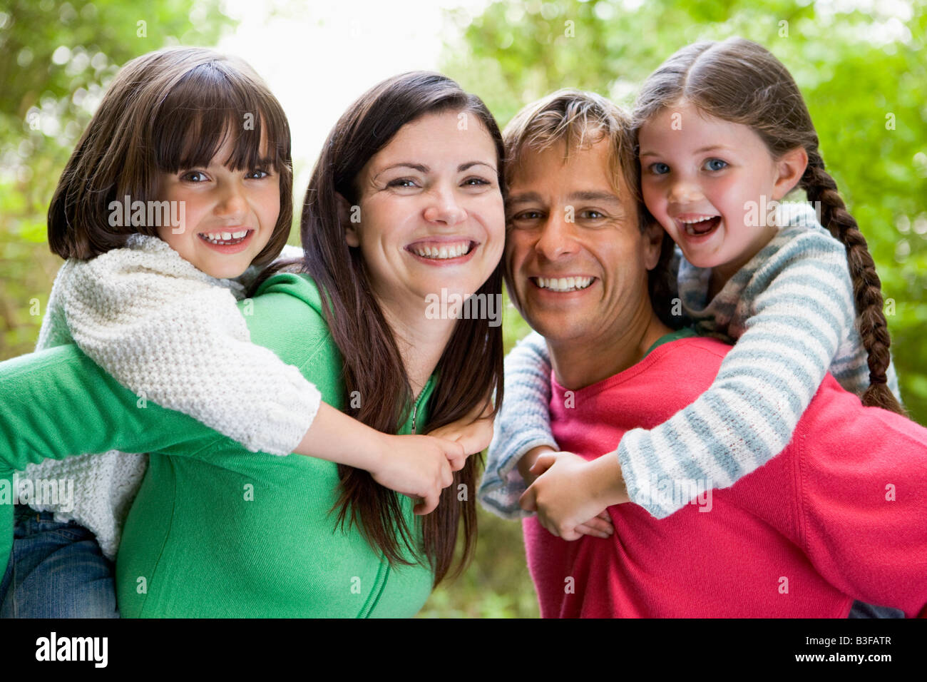 Family outdoors smiling Stock Photo - Alamy