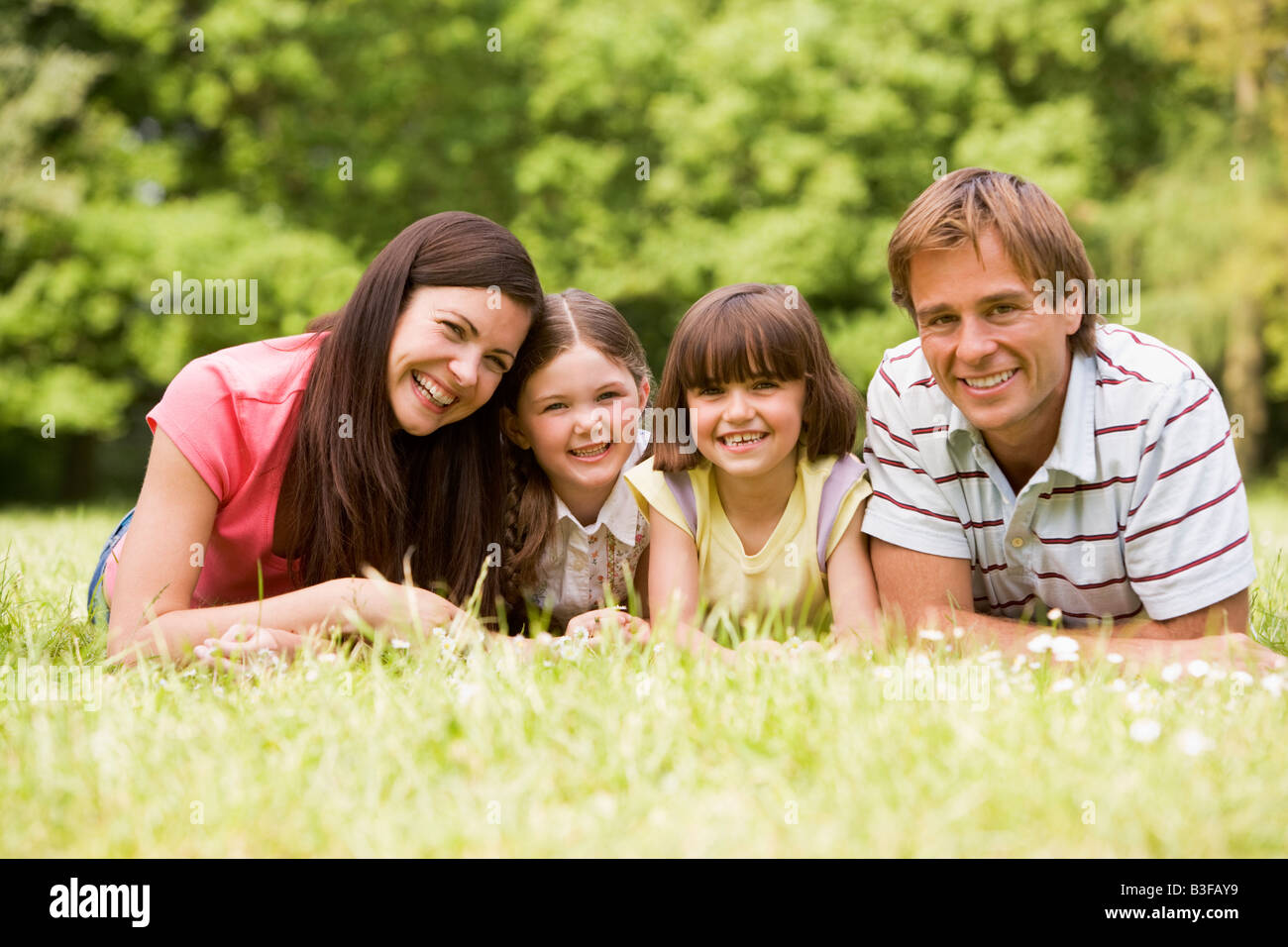Family outdoors smiling Stock Photo - Alamy