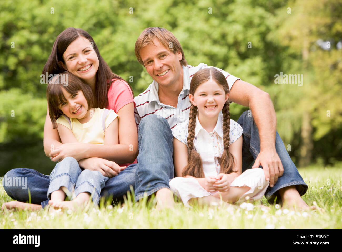 Family outdoors smiling Stock Photo - Alamy