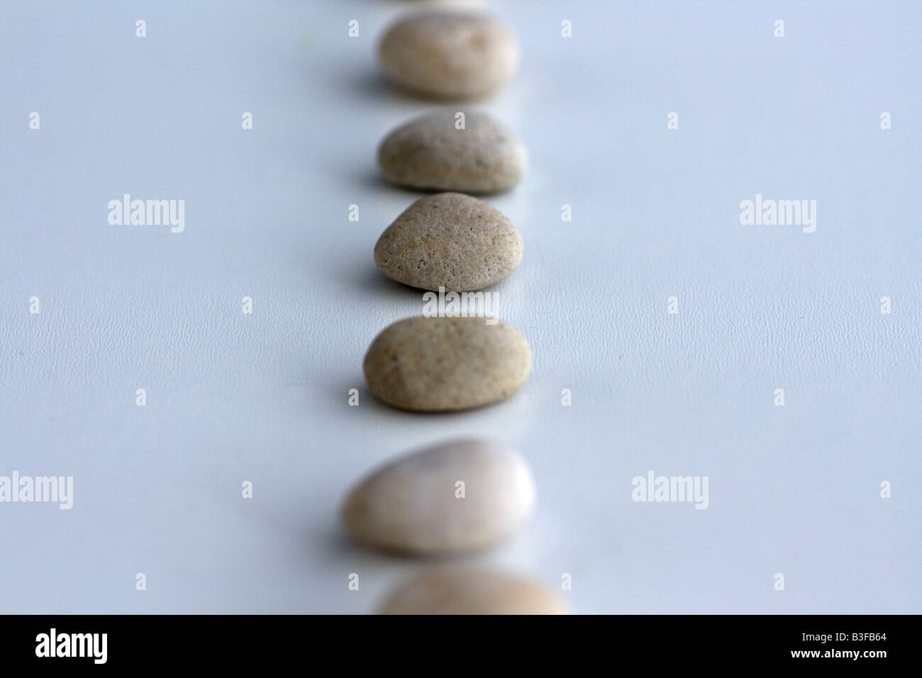 A row of pebbles Stock Photo - Alamy