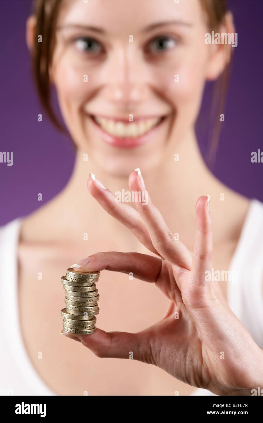 Hand pound coins hi-res stock photography and images - Alamy