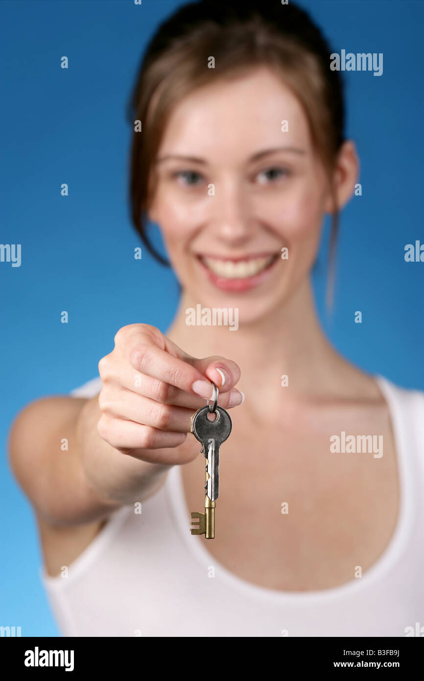 Young woman holding a set of keys Stock Photo - Alamy