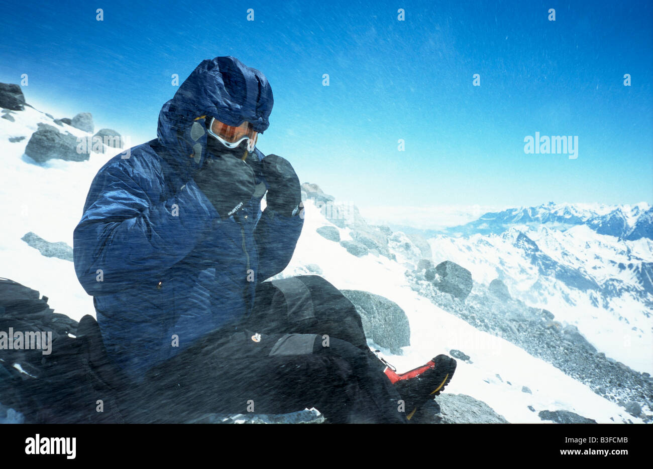 Mountain climber exposed to strong winds and snow on Pastuckhov Rocks ...