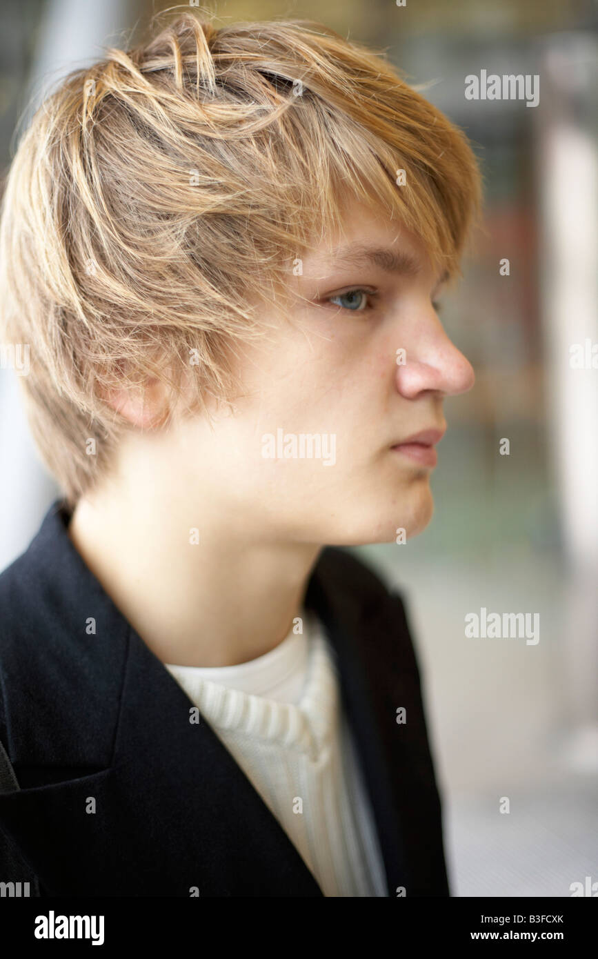 Side profile of teenage boy in urban environment, interior Stock Photo ...