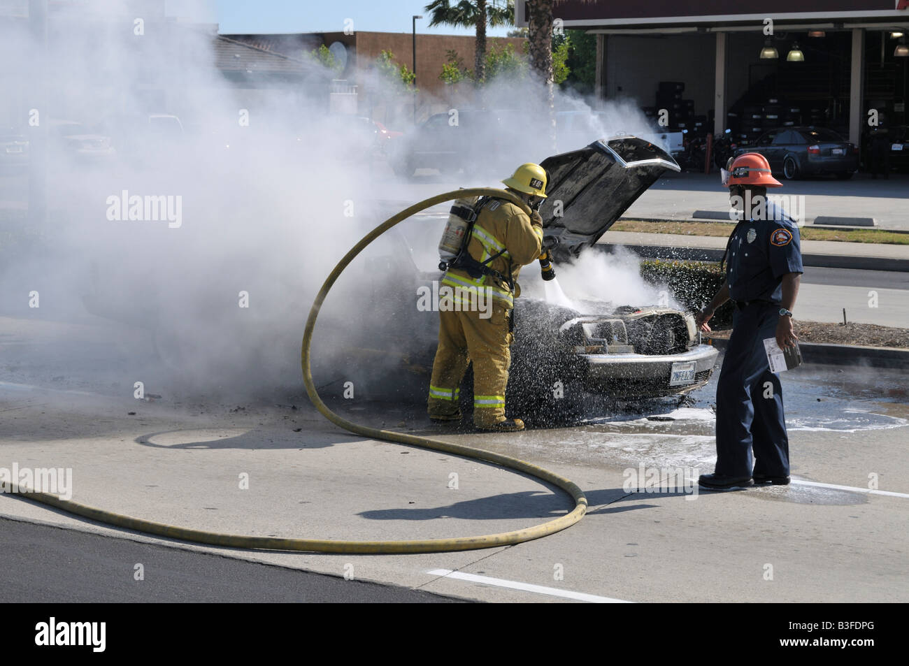 Putting out fire hi-res stock photography and images - Alamy