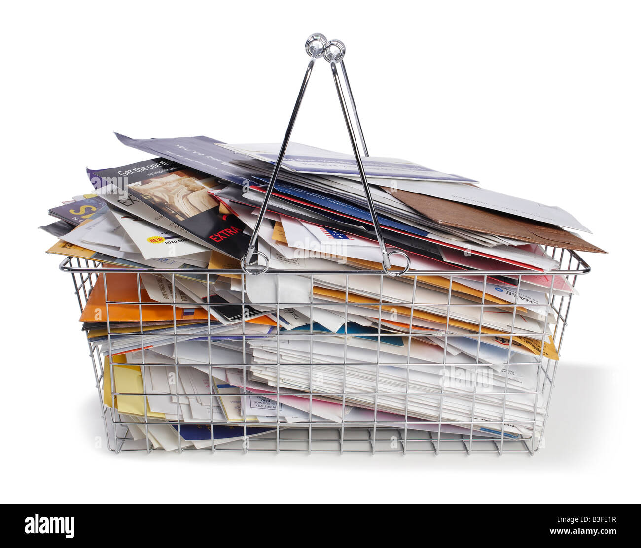 Shopping basket with junk mail Stock Photo - Alamy