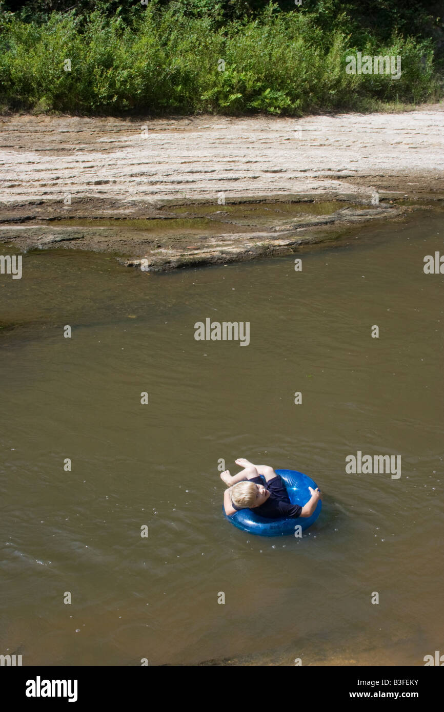 Floating down river innertube Stock Photo - Alamy
