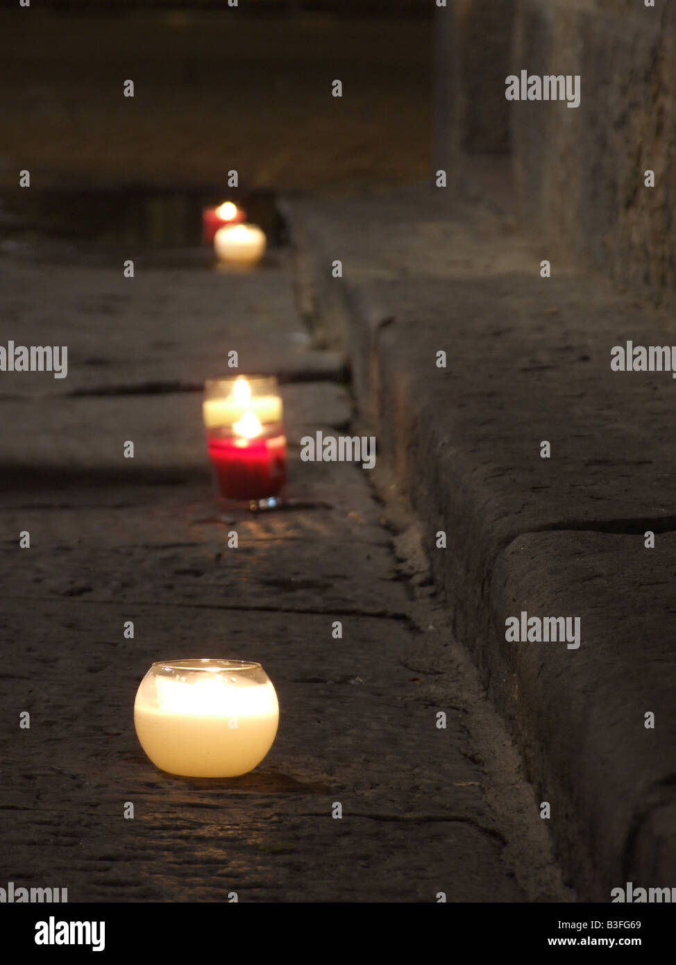 row of candles outdoors at night Stock Photo - Alamy