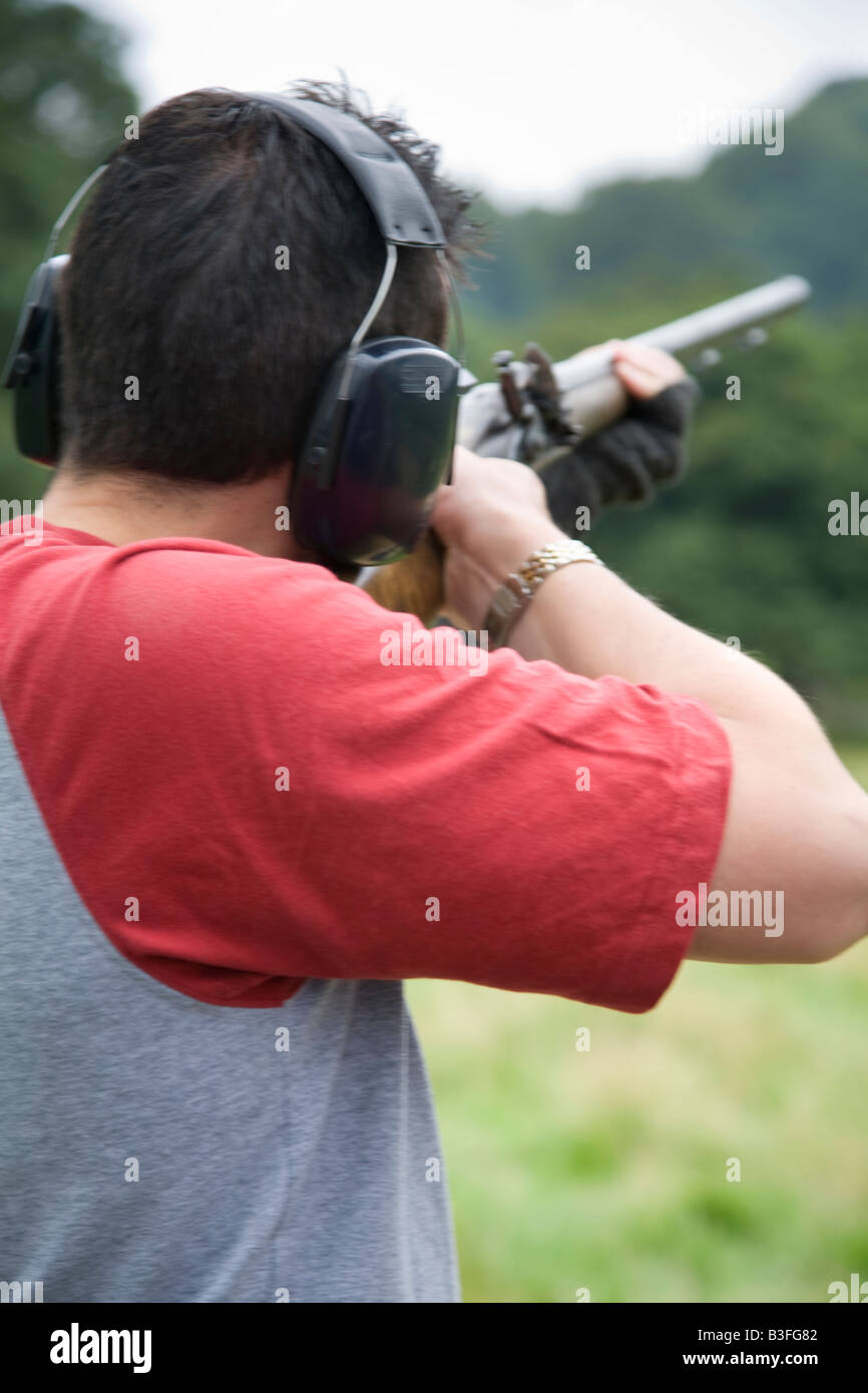 Man holding pointing aiming Shotgun at Chatsworth Country Fair ...