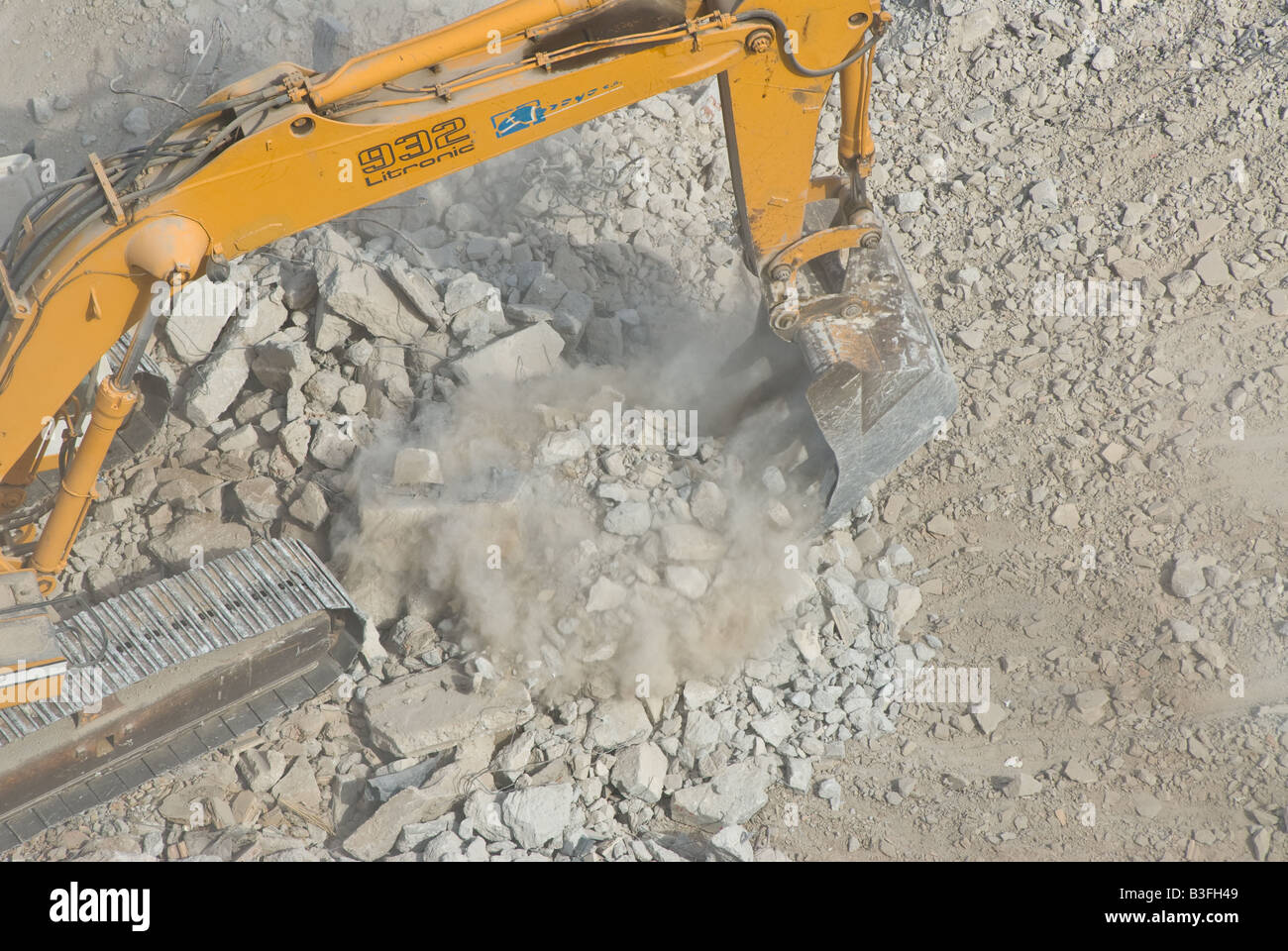 crawler bucket excavator scooping up rocks Stock Photo - Alamy