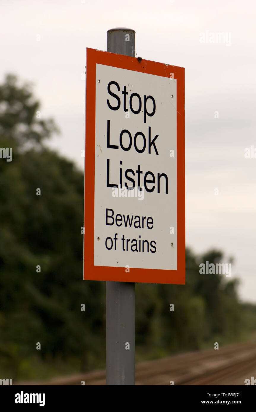 Stop look listen beware of trains warning sign hi-res stock photography ...