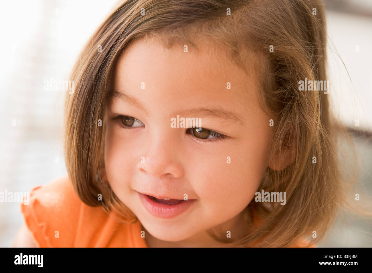 Young girl indoors Stock Photo - Alamy