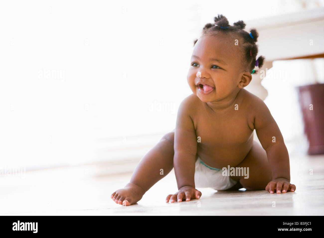 Baby girl diaper crawling hi-res stock photography and images - Alamy