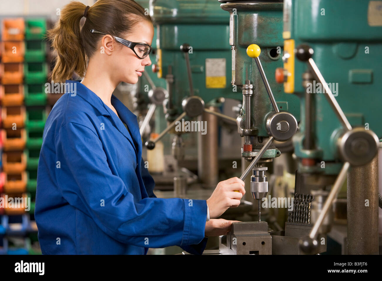 Woman operating machinery drill hi-res stock photography and images - Alamy