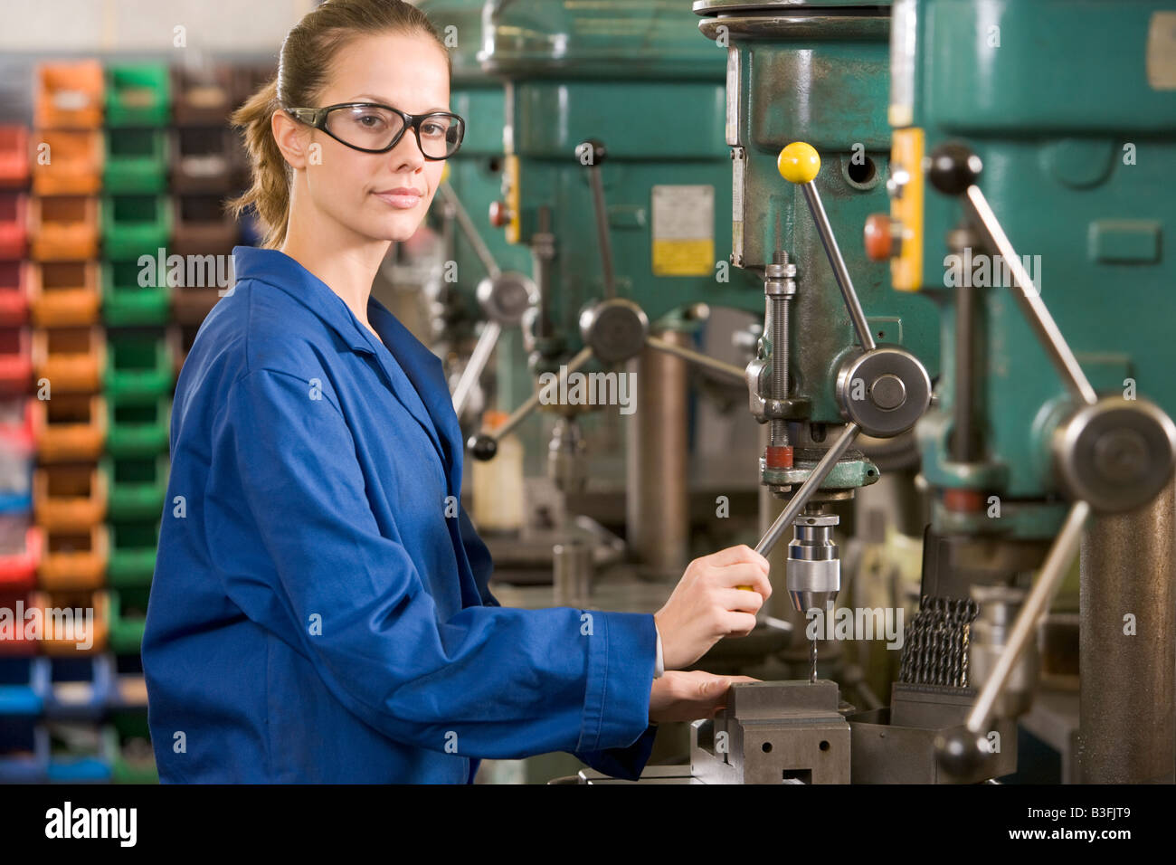 Woman operating machinery drill hi-res stock photography and images - Alamy