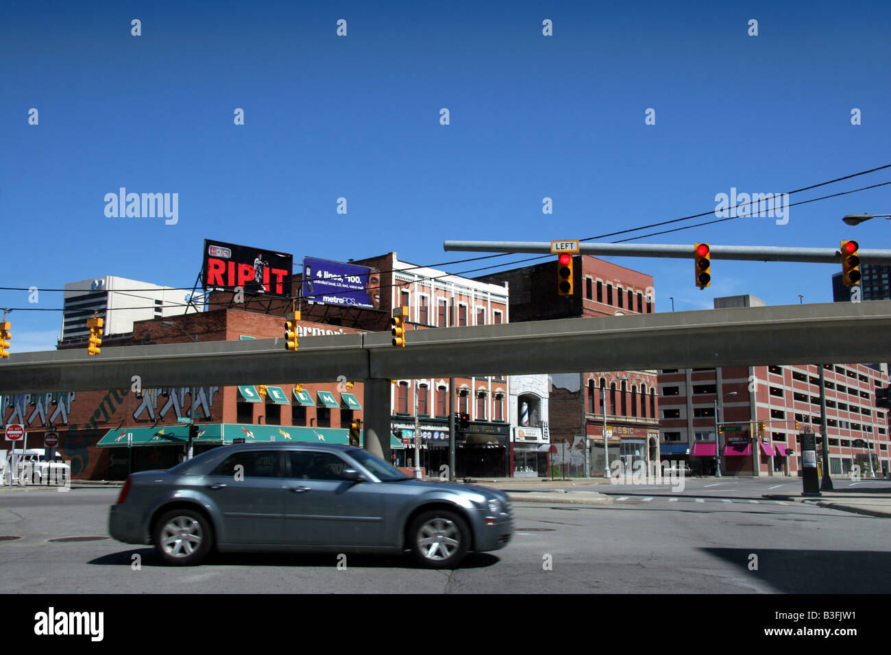Car driving through street hi-res stock photography and images - Alamy
