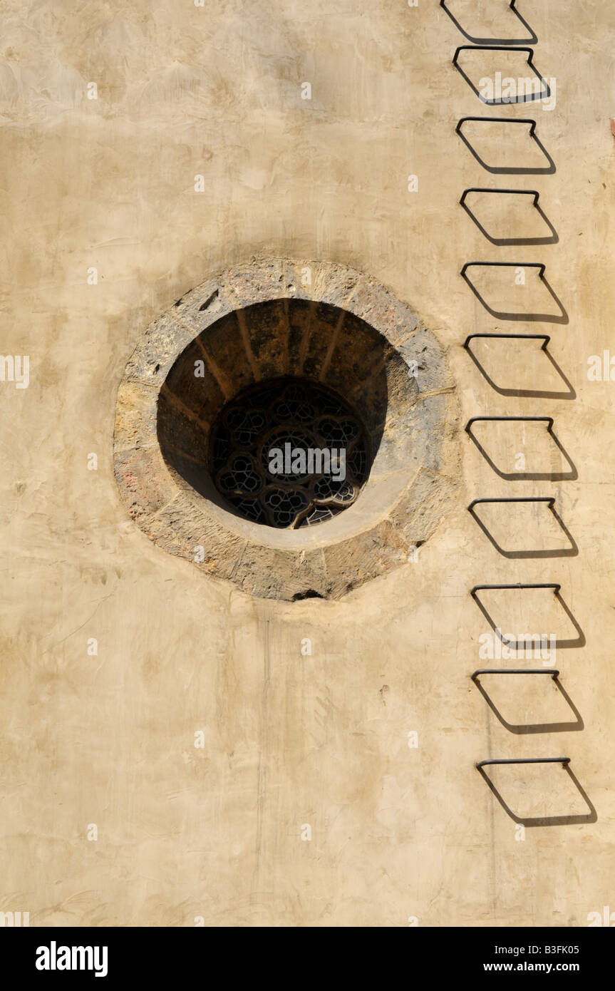 Round deep set window on the western wall of the Prague Old New ...