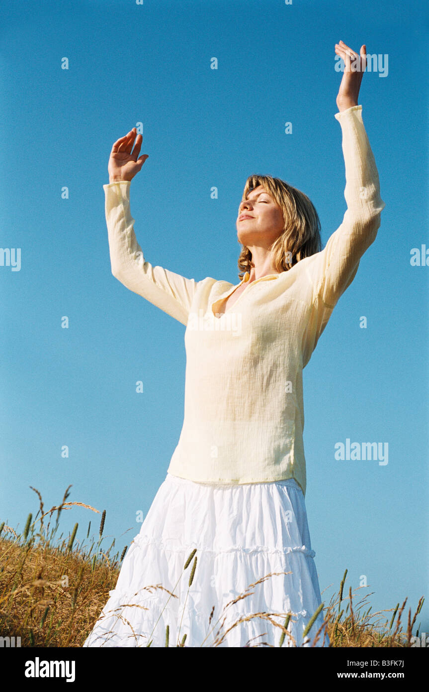 Woman standing outdoors Stock Photo - Alamy